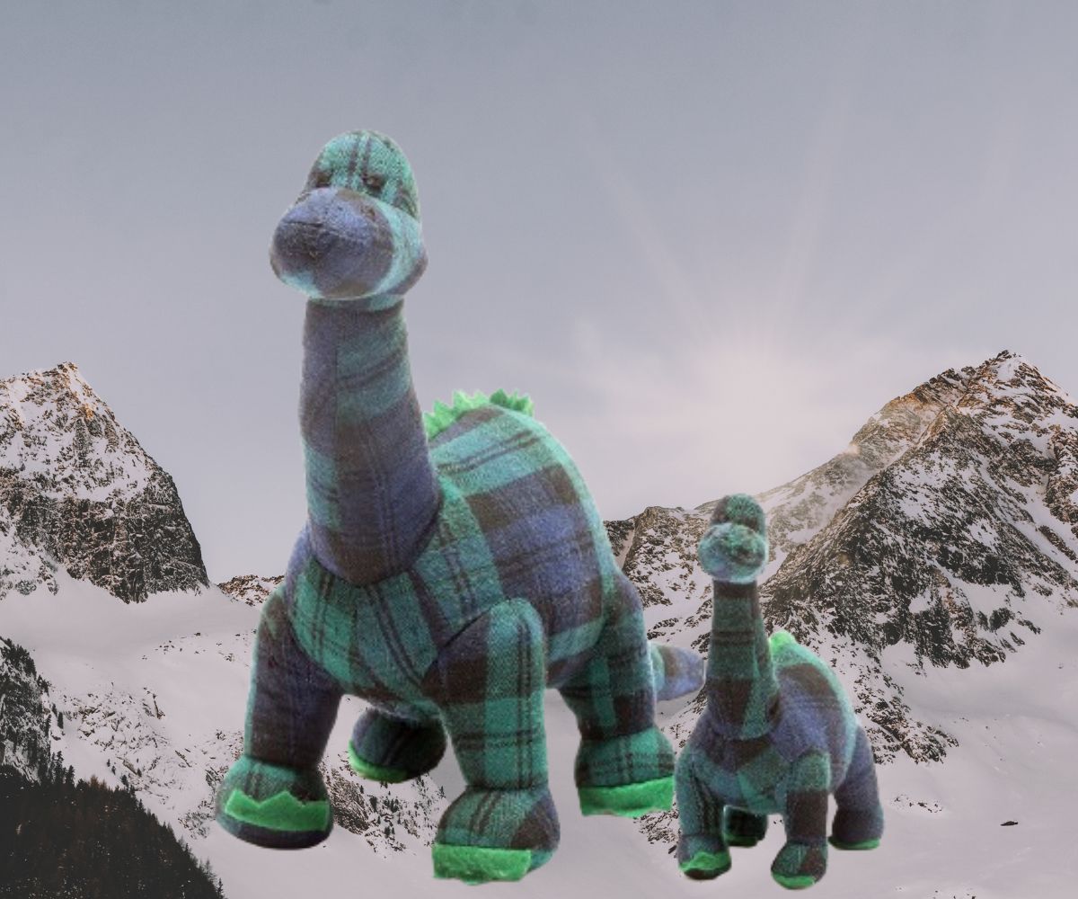 Knitted diplodocus dinosaur toy in blue tartan, dinosaur teddy