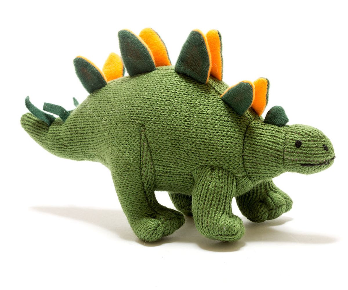 Knitted stegosaurus dinosaur baby rattle in moss green & orange spikes