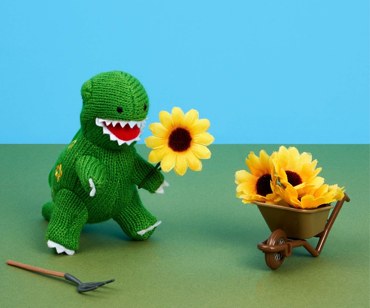 Knitted T Rex dinosaur with flowers Spring hanging decoration